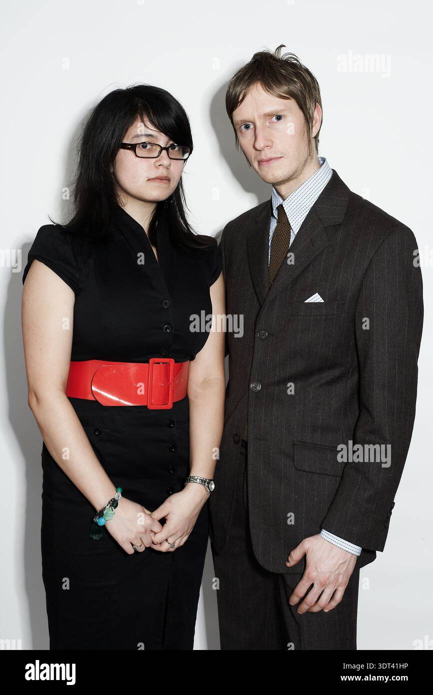 Young couple styled in 1960s-inspired fashion documenting the modern ...