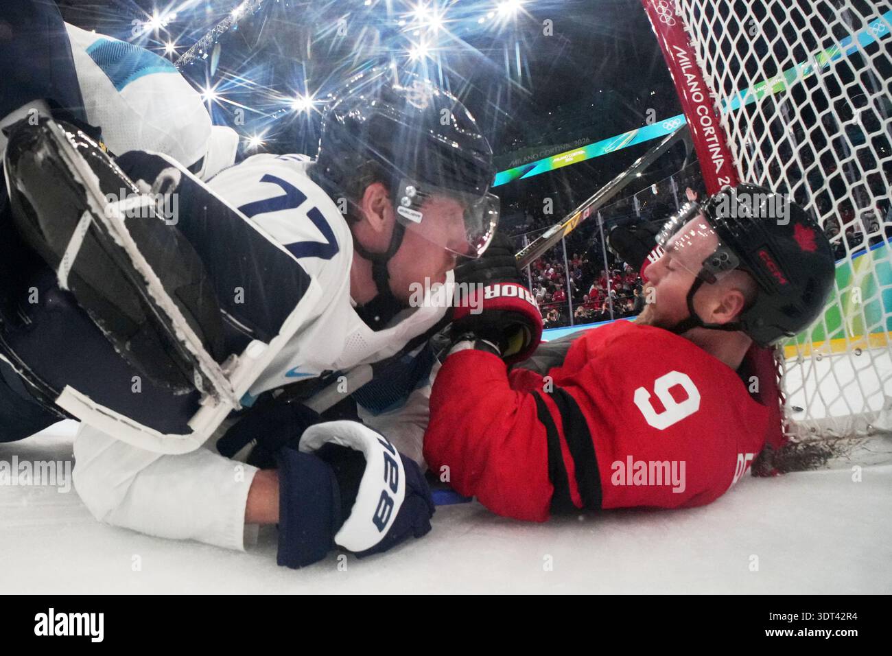 Canada's Sam Bennett (9) challenges with Finland's Niko Mikkola (77 ...