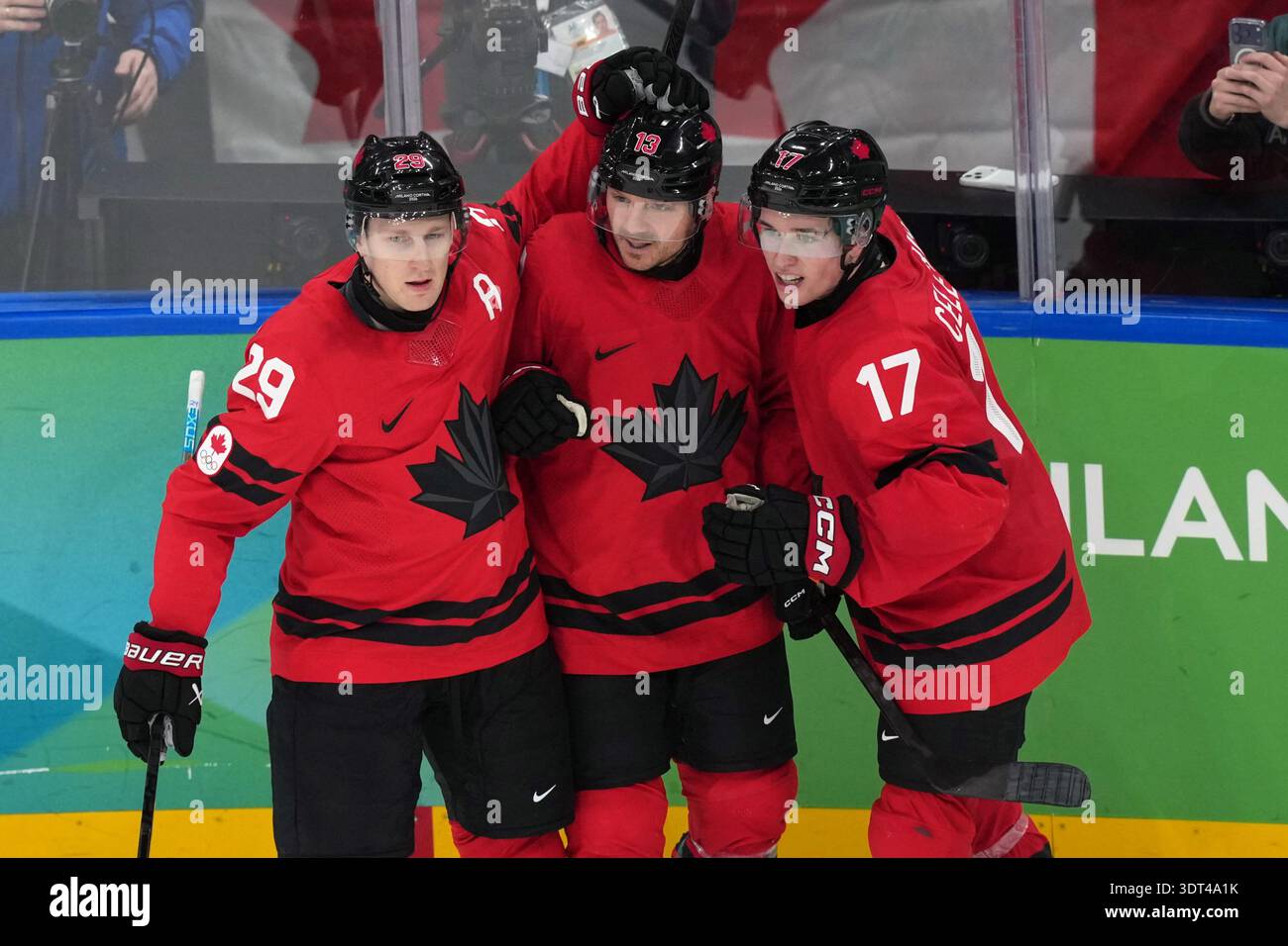 Canada's Sam Reinhart (13) celebrates with Nathan MacKinnon (29) and ...
