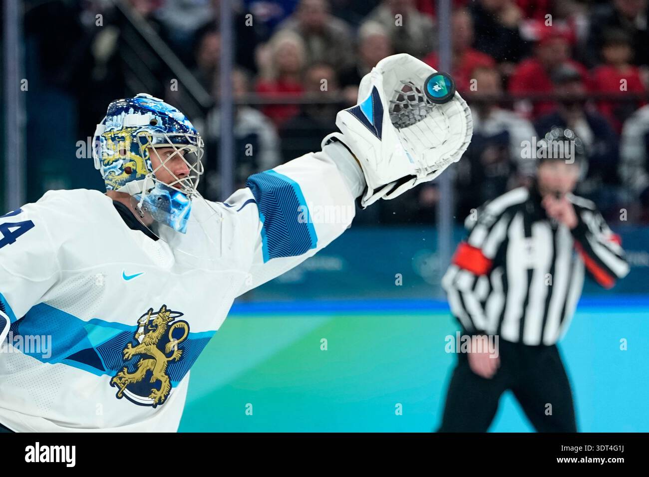 Finland's Juuse Saros (74) makes a save during a men's ice hockey ...