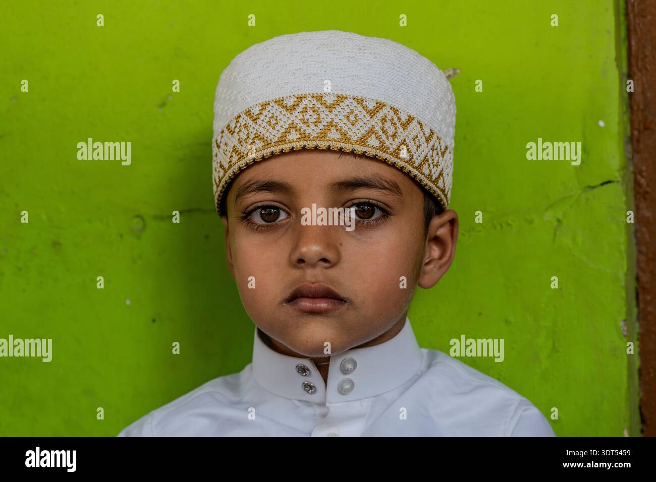 A portrait of a Muslim boy on the first Friday of the holy month of ...