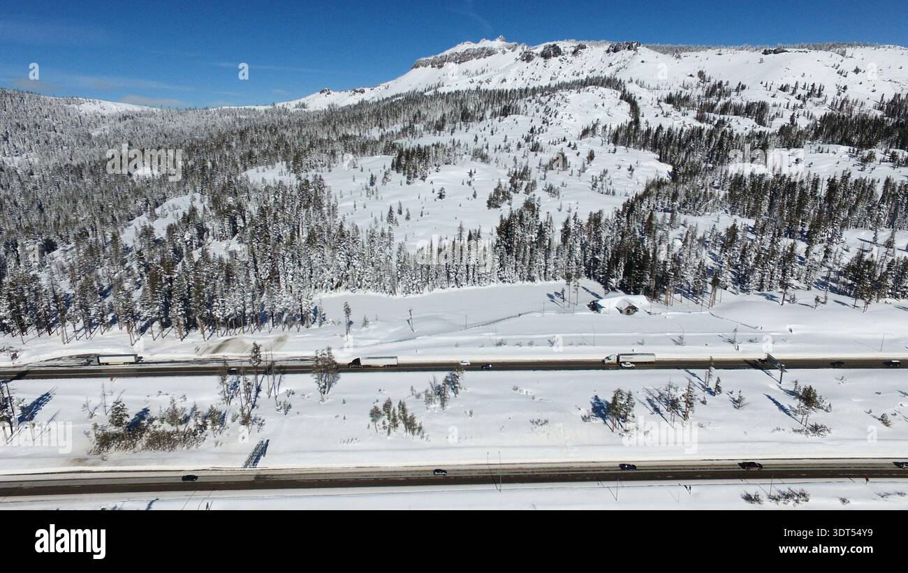 Motorists make their way along interstate 80 with Castle Peak as a ...