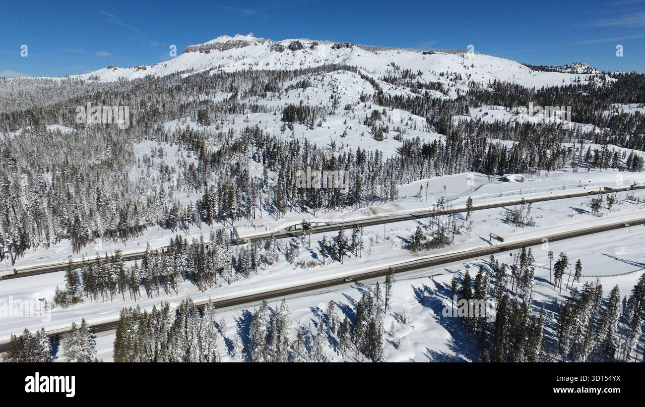 Motorists make their way along interstate 80 with Castle Peak as a ...