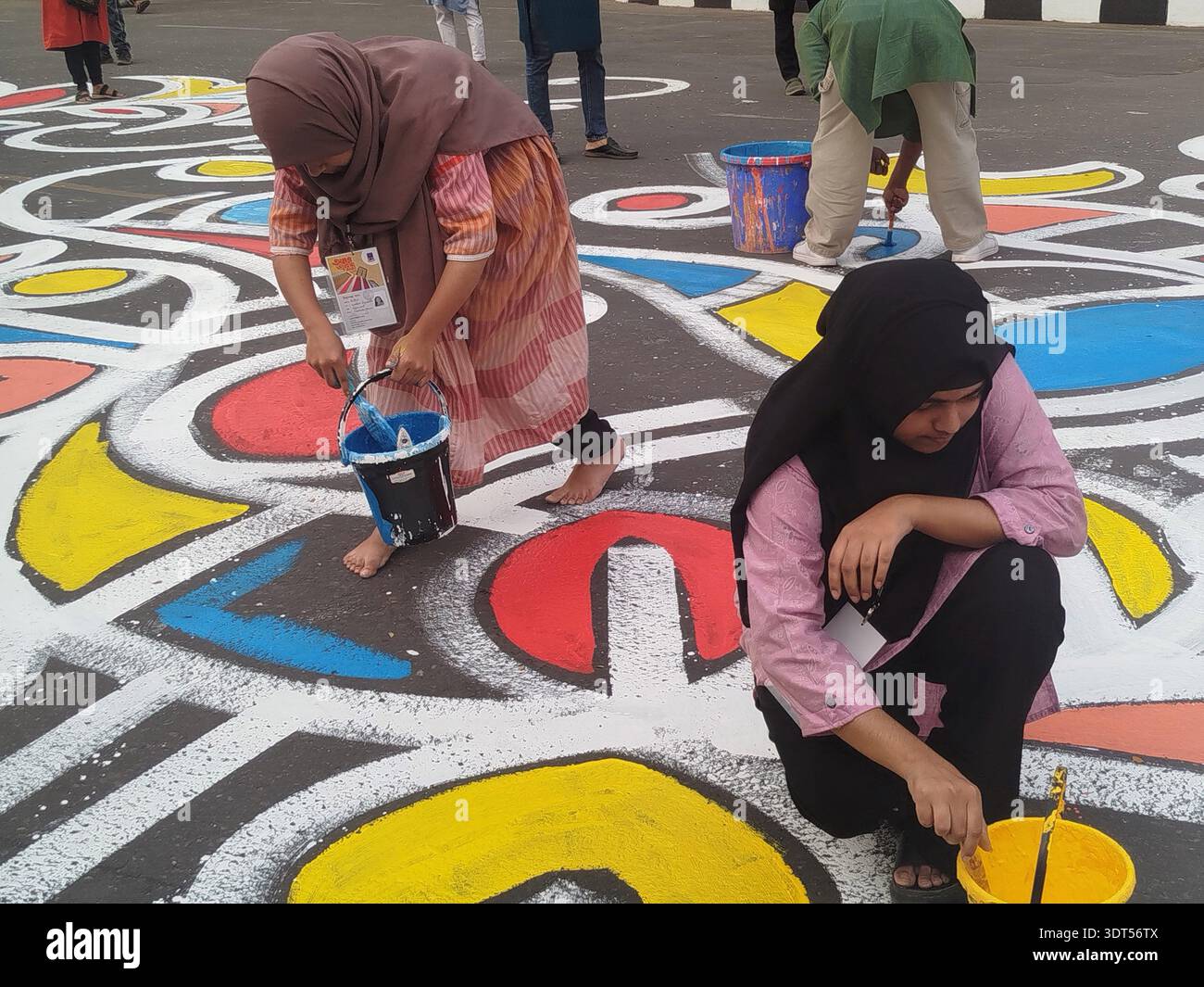 February 21, 2026, Dhaka, Bangladesh: Volunteers drew alpana motifs ...