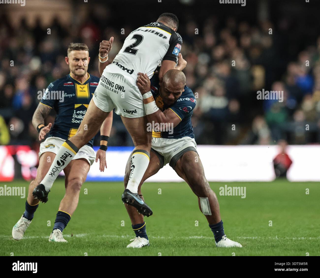 Ben Jones-Bishop of York Knights is tackled by Maika Sivo of Leeds ...