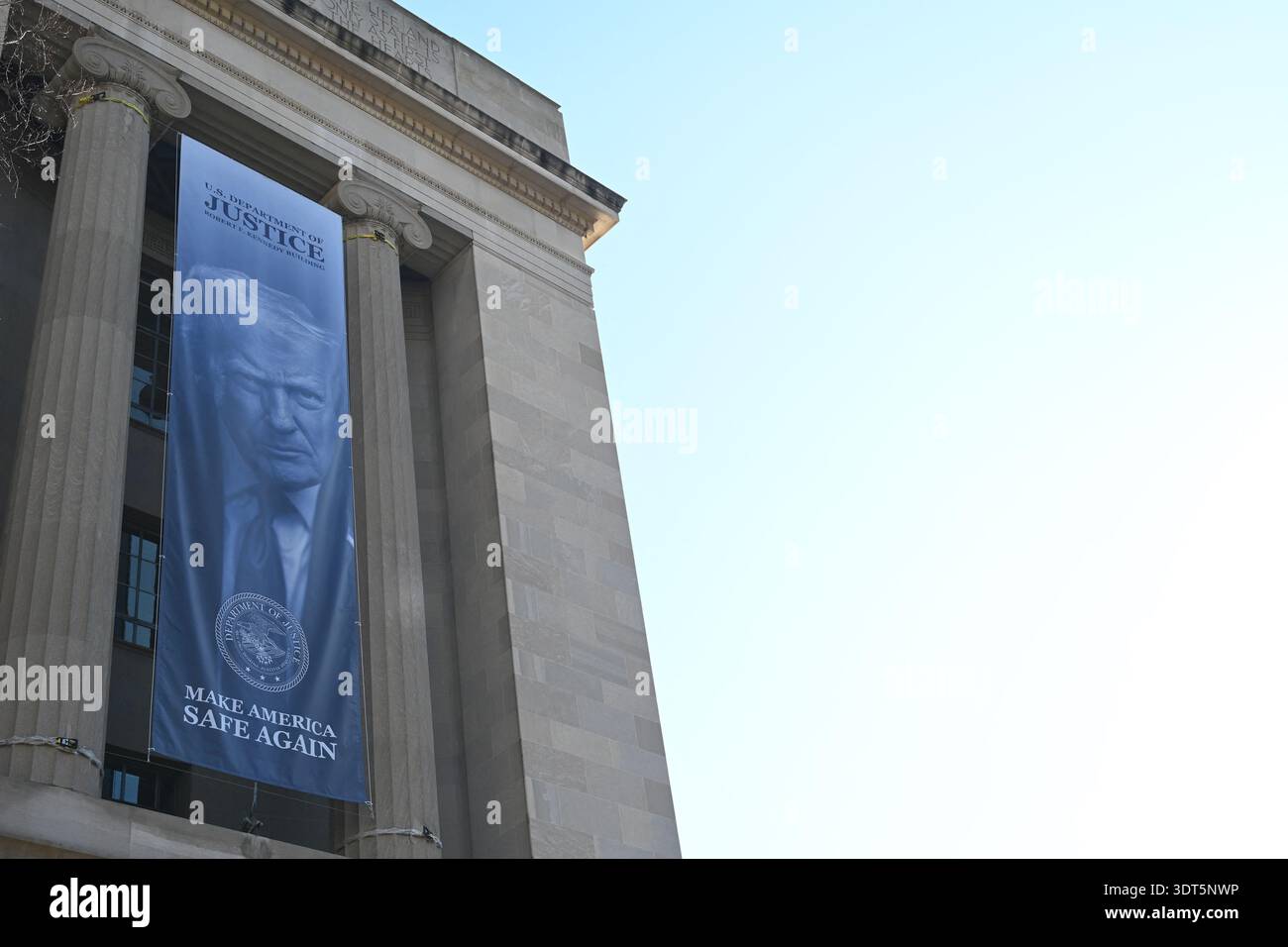 A giant banner featuring a picture of Donald Trump now hangs in front ...