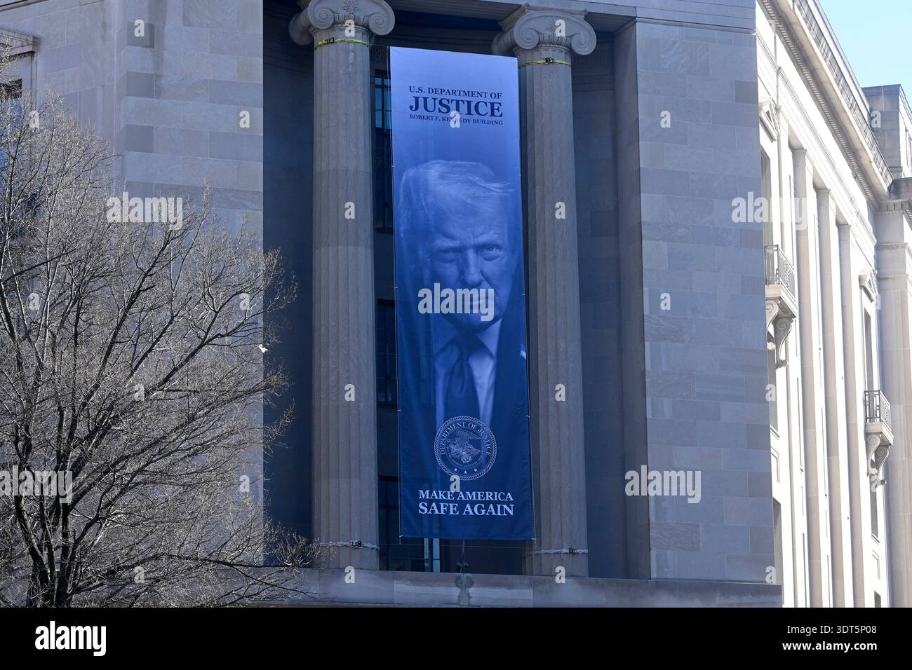 A giant banner featuring a picture of Donald Trump now hangs in front ...