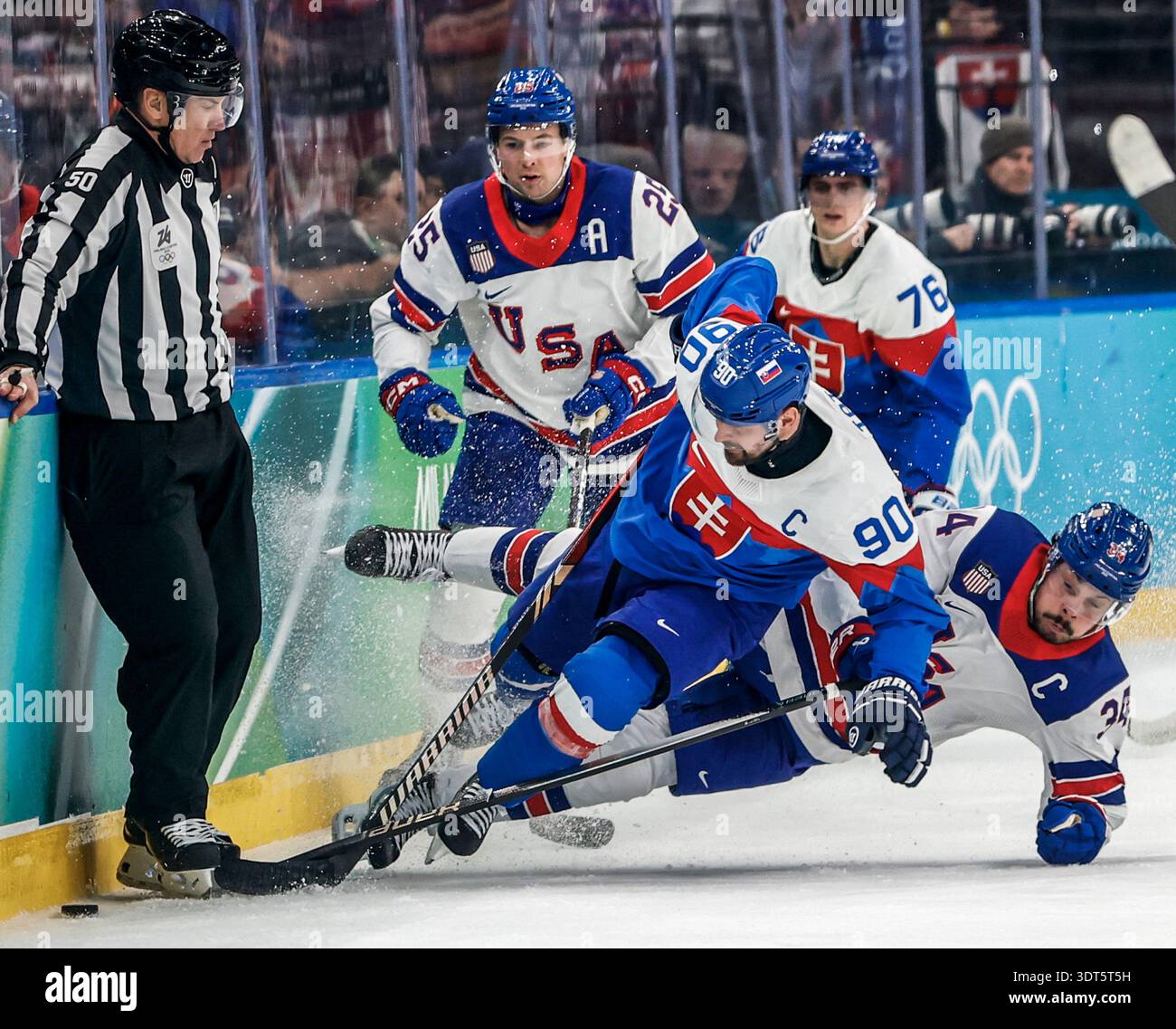 Slovakia's Tomas Tatar (90) and United States' Auston Matthews (34) go ...