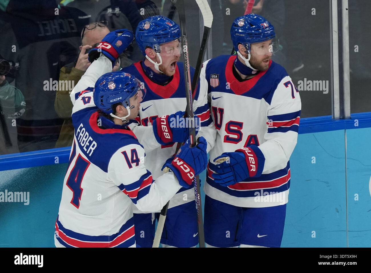 United States' Jack Eichel, center, celebrates with Brock Faber (14 ...