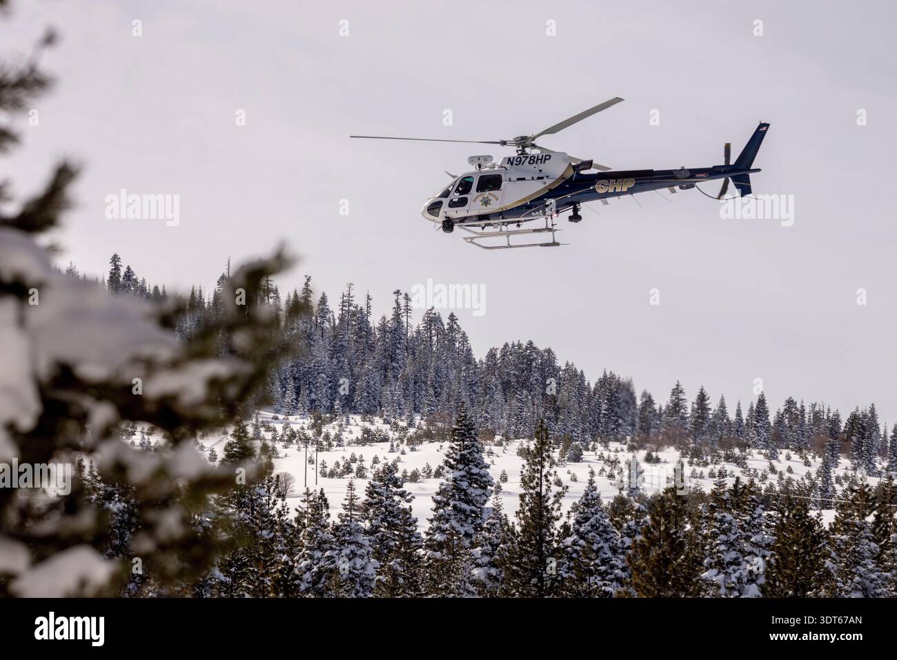 A California Highway Patrol helicopter lifts off from a field after a ...
