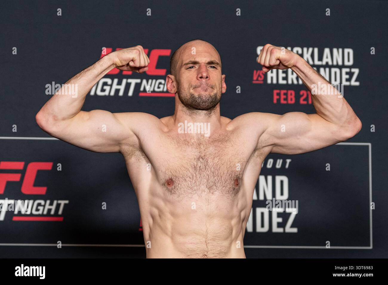 Fighter Uros Medic steps on the scale for the official weigh-in at the ...