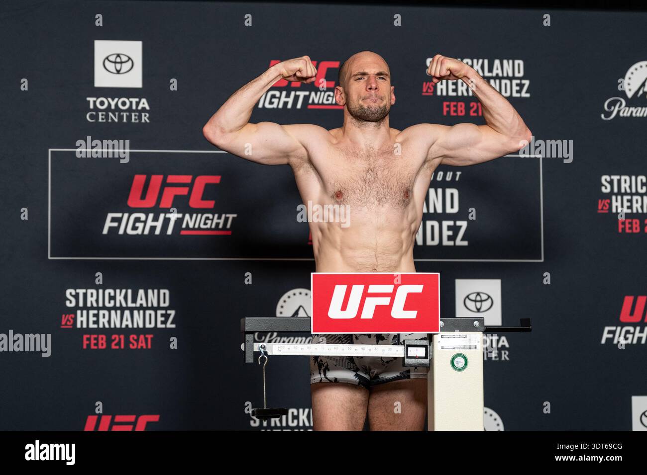 Fighter Uros Medic steps on the scale for the official weigh-in at the ...