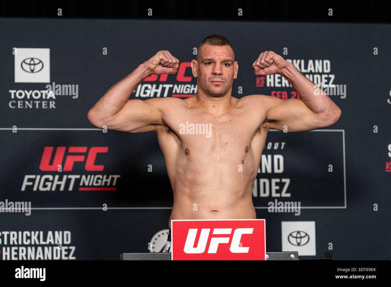Fighter Ante Delija steps on the scale for the official weigh-in at the ...