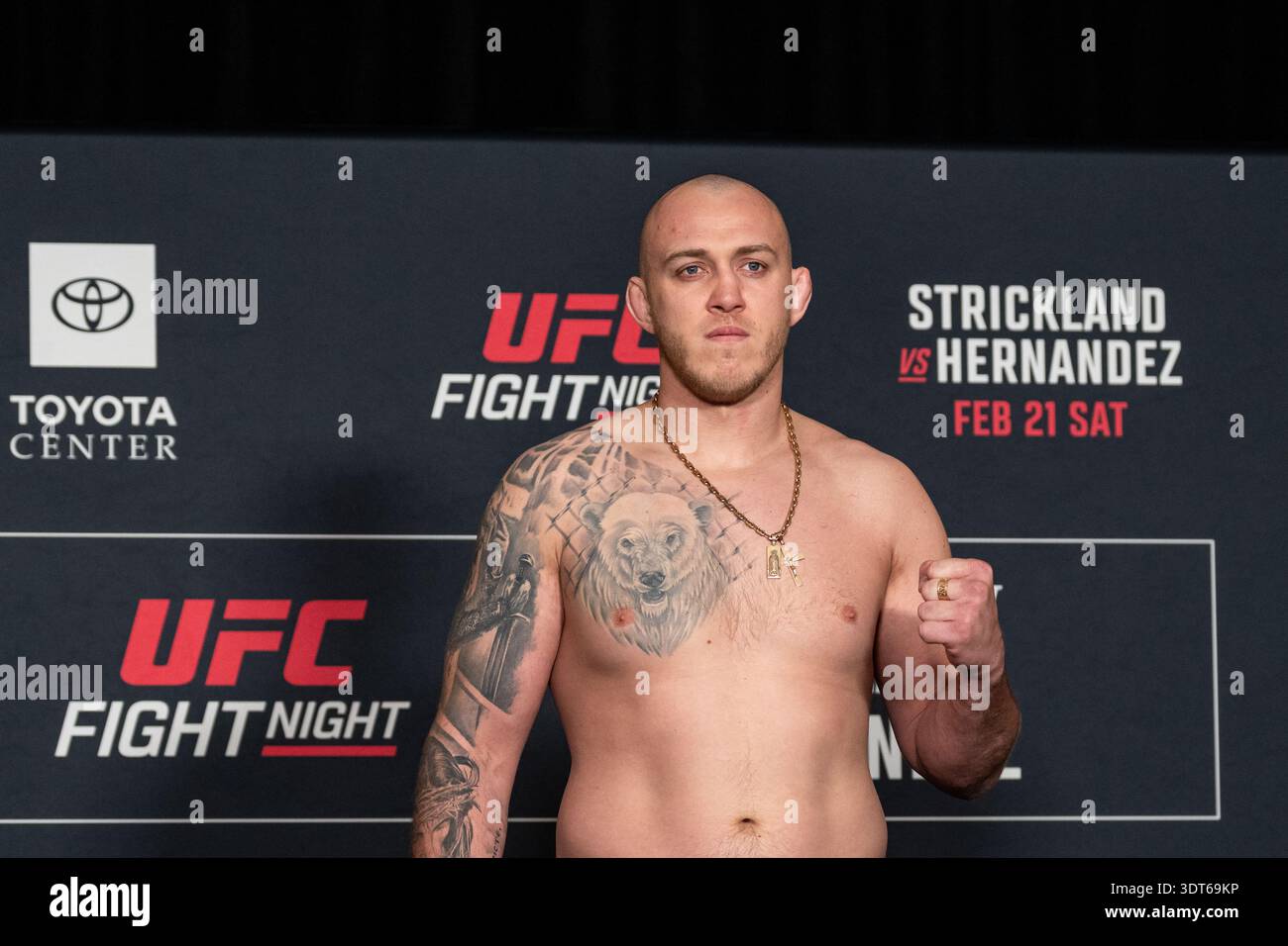 Fighter Serghei Spivac steps on the scale for the official weigh-in at ...