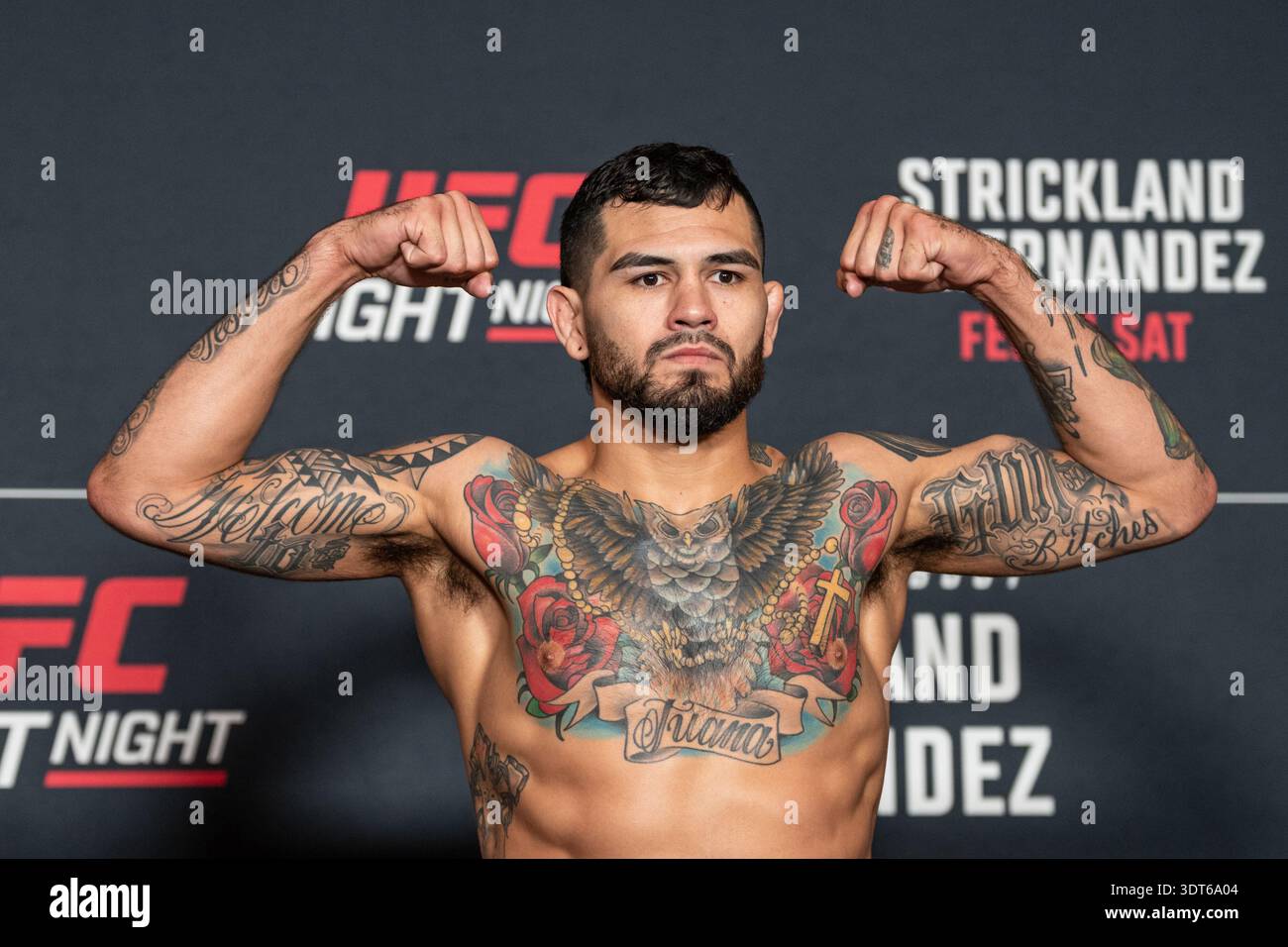 Fighter Anthony Hernandez steps on the scale for the official weigh-in ...