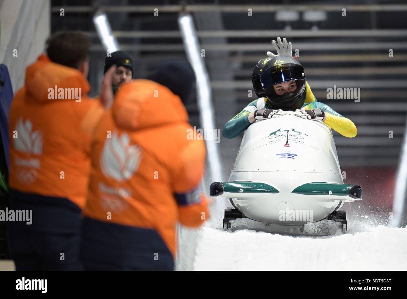 Desi Johnson taps the helmet of Sarah Blizzard of team Australia after ...