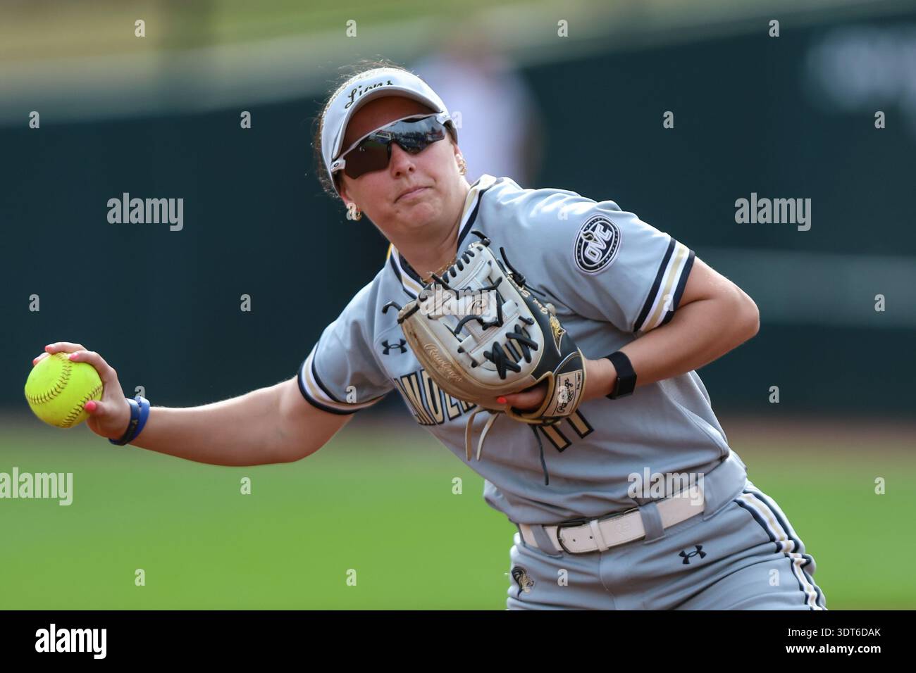 Lindenwood infielder Justine Davidson (11) warms up before an NCAA ...