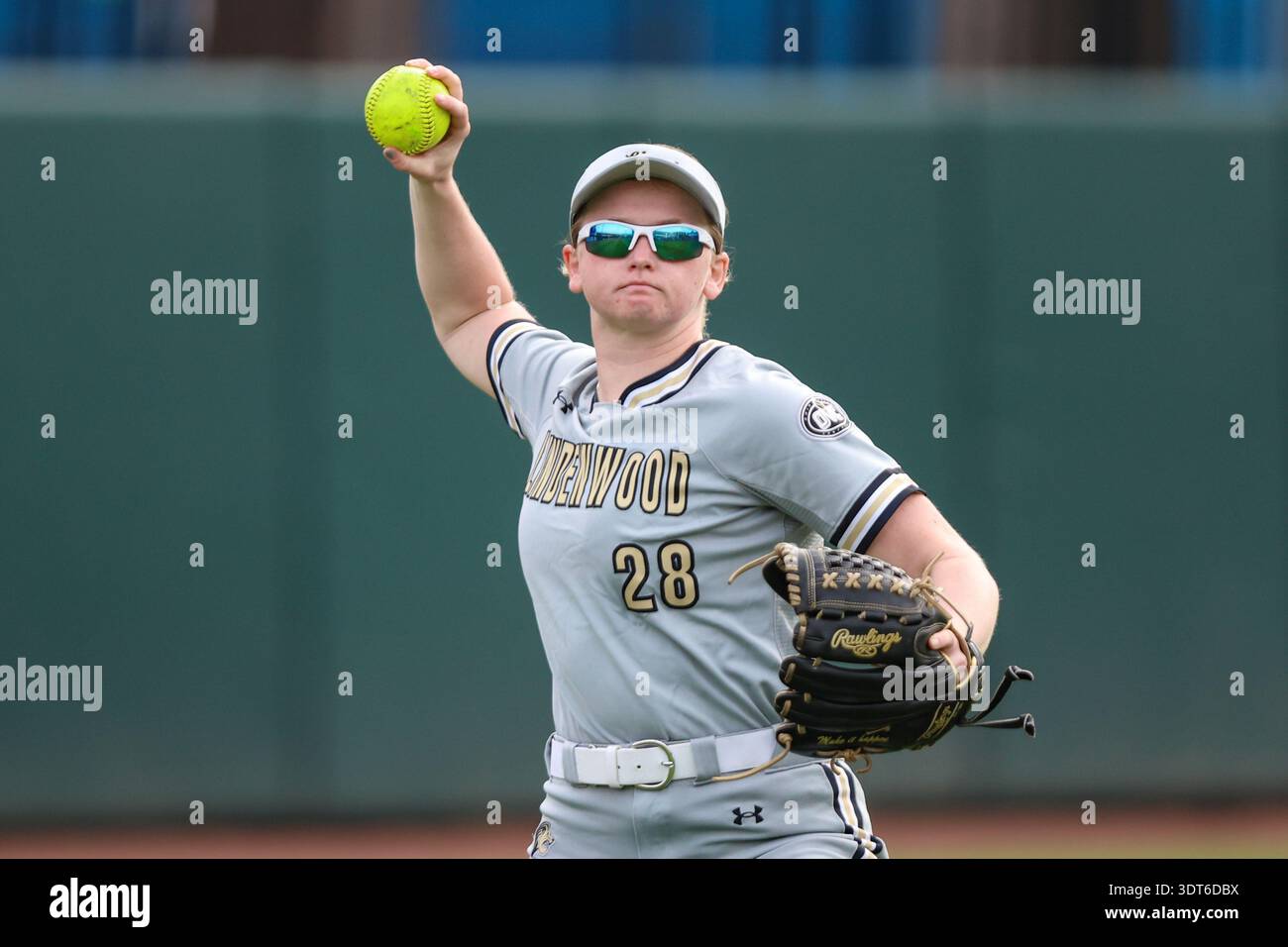 Lindenwood infielder Emily Geary (28) warms up before an NCAA softball ...