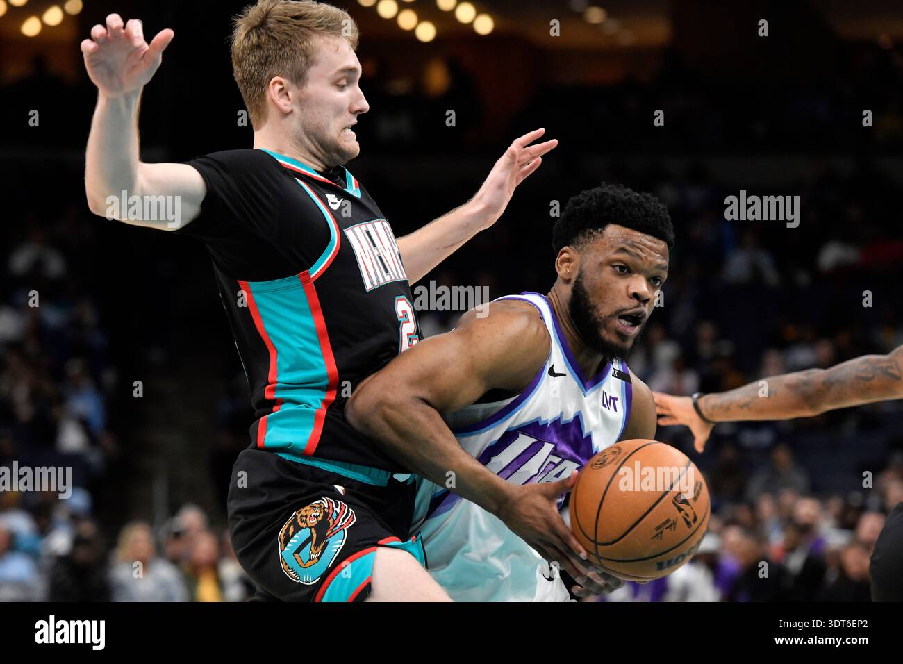 Utah Jazz guard Elijah Harkless, right, handles the ball against ...