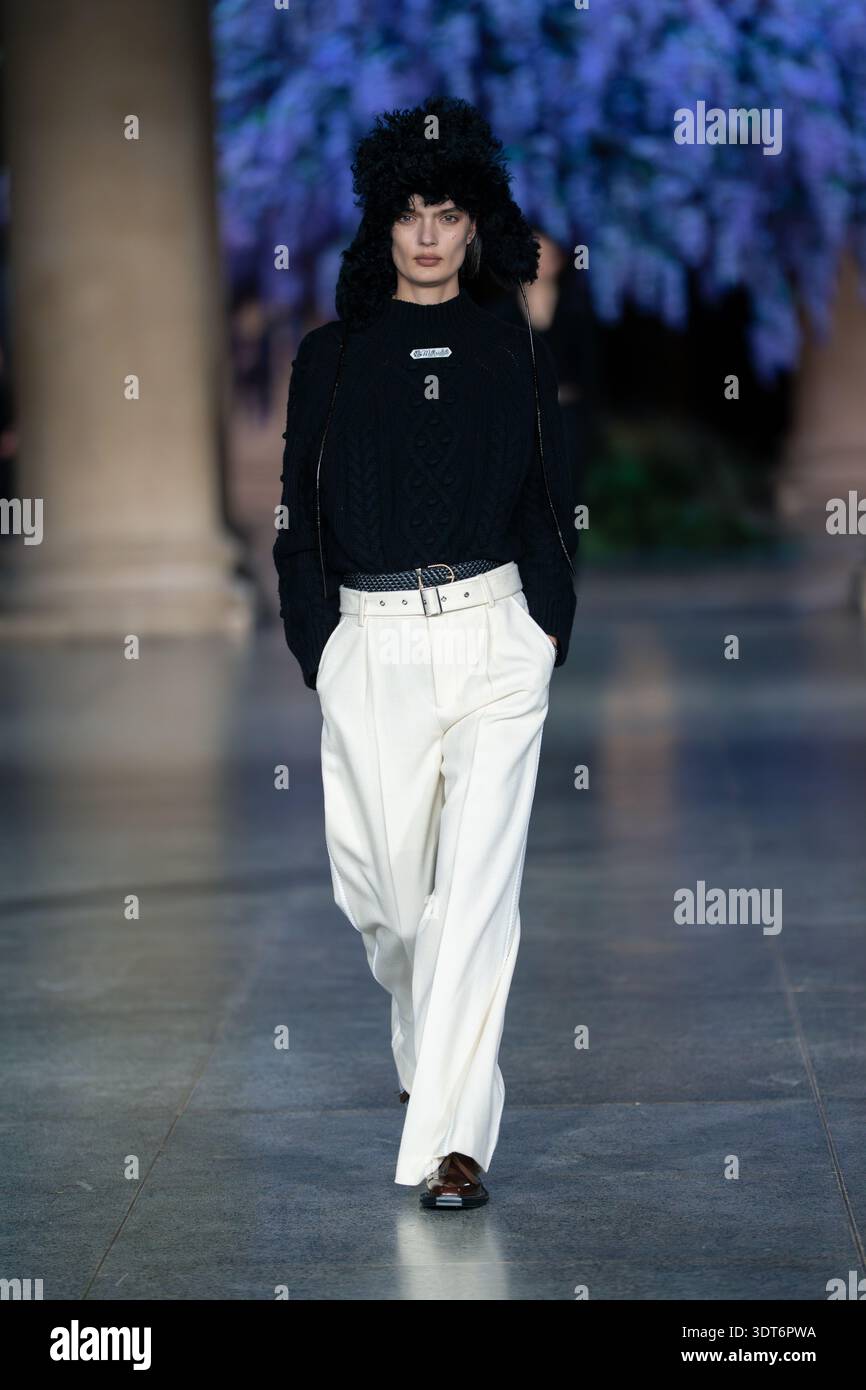 A model walks the runway at the Mithridate show during London Fashion ...
