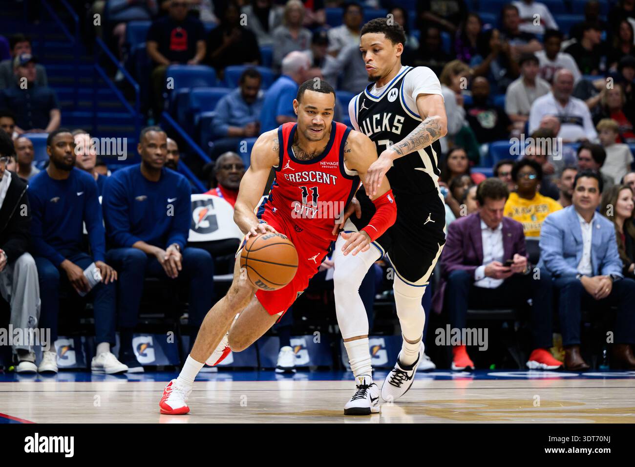 New Orleans Pelicans guard Bryce McGowens (11), left, running the ball ...