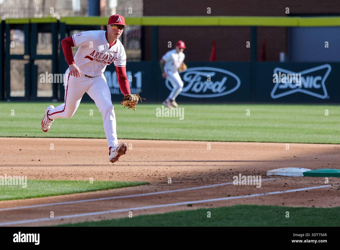 February 20, 2026: Razorback first baseman Reese Robinett (18) heads ...
