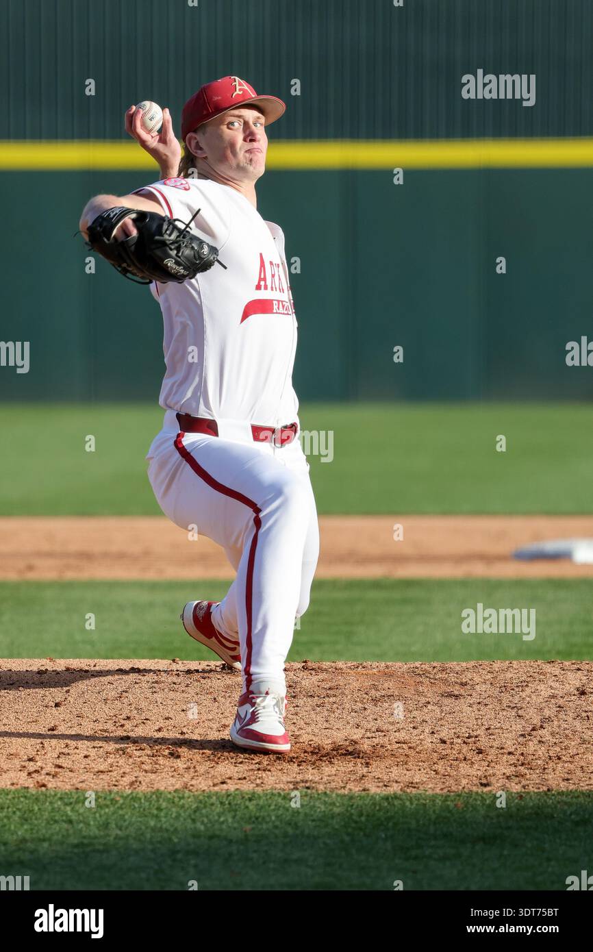 February 20, 2026: Hogs pitcher Cole Gibler (29) strides down the mound ...