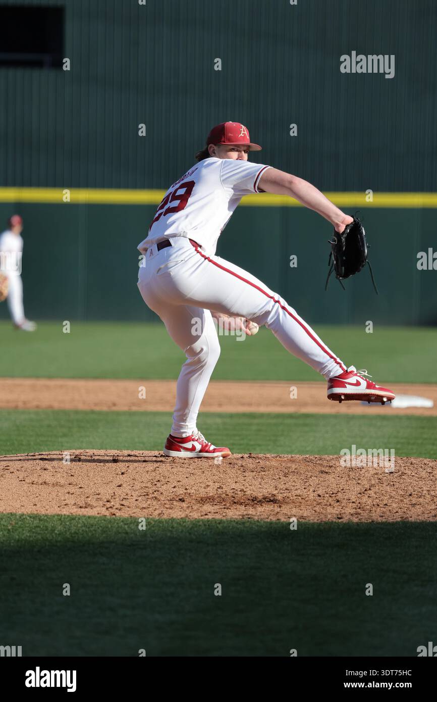 February 20, 2026: Hogs pitcher Cole Gibler (29) begins his windup on ...