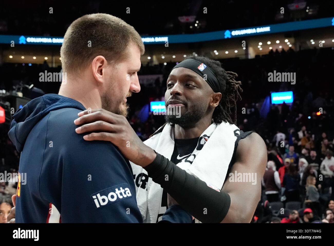 Denver Nuggets center Nikola Jokić, left, greets Portland Trail Blazers ...