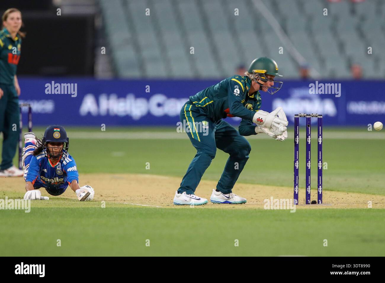 Adelaide, Australia. 21st Feb, 2026. Jemimah Rodrigues of India dives ...