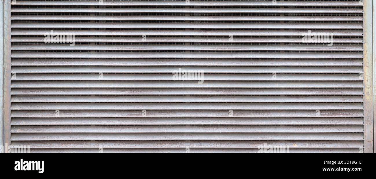 Horizontal metal slats creating an air intake louver design for a ...