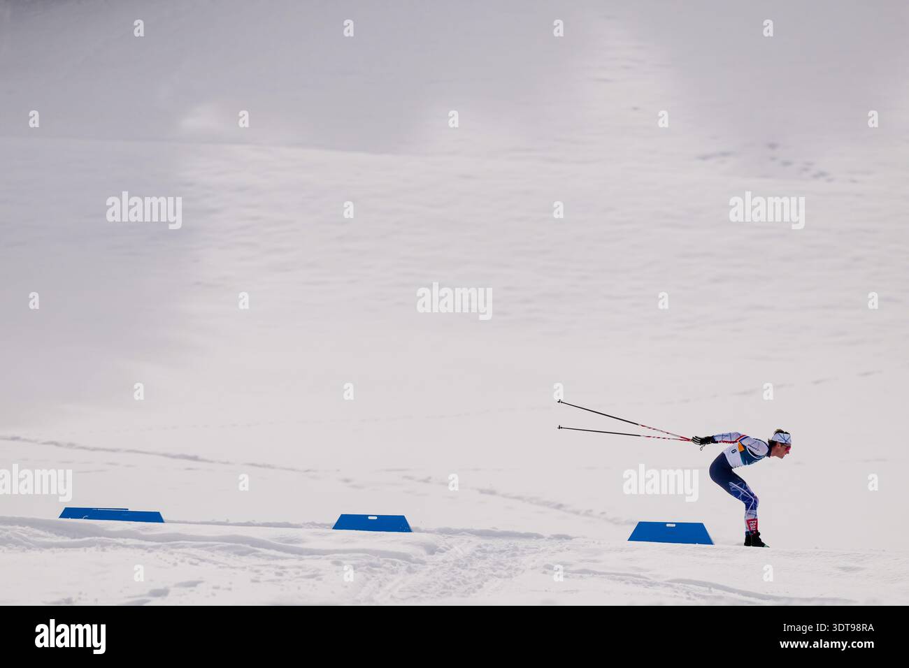 Mathis Desloges, of France, competes in the cross country skiing men's ...