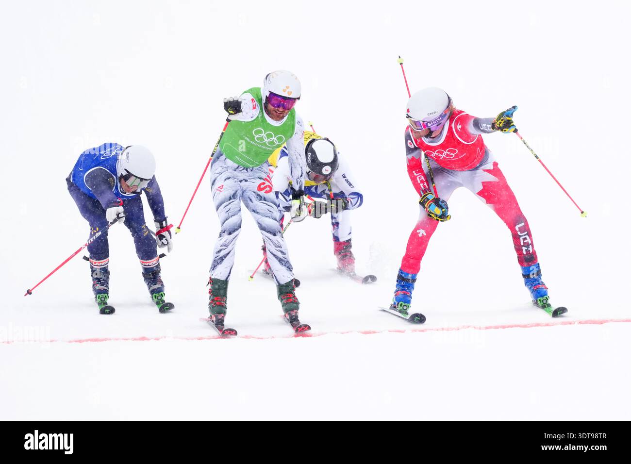 Canada's Jared Schmidt, right, reaches to come into the finish line ...