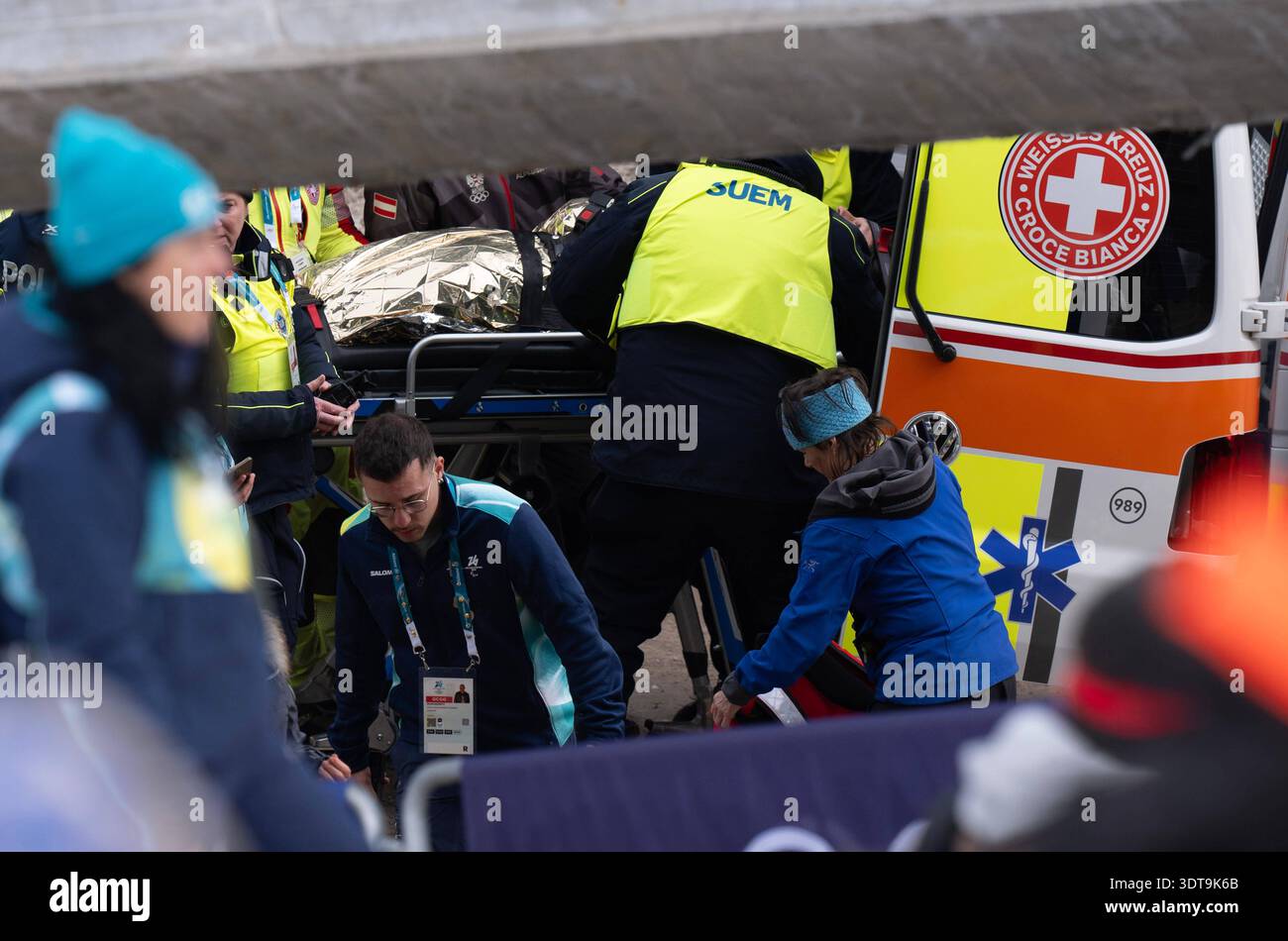 260221 -- CORTINA D AMPEZZO, Feb. 21, 2026 -- Rescue workers lift Jakob ...
