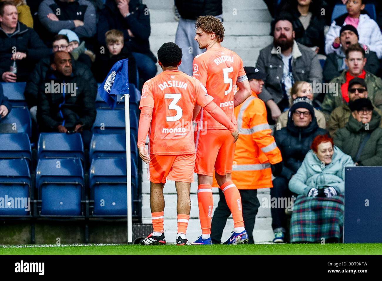 5, Jack Rudoni of Coventry City is congratulated for the goal by 3 Jay ...