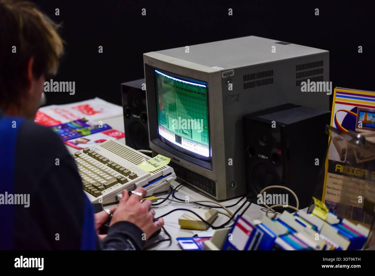 A man seen using vintage 1992 Commodore Amiga 600 also known as A600 home computer connected to ...