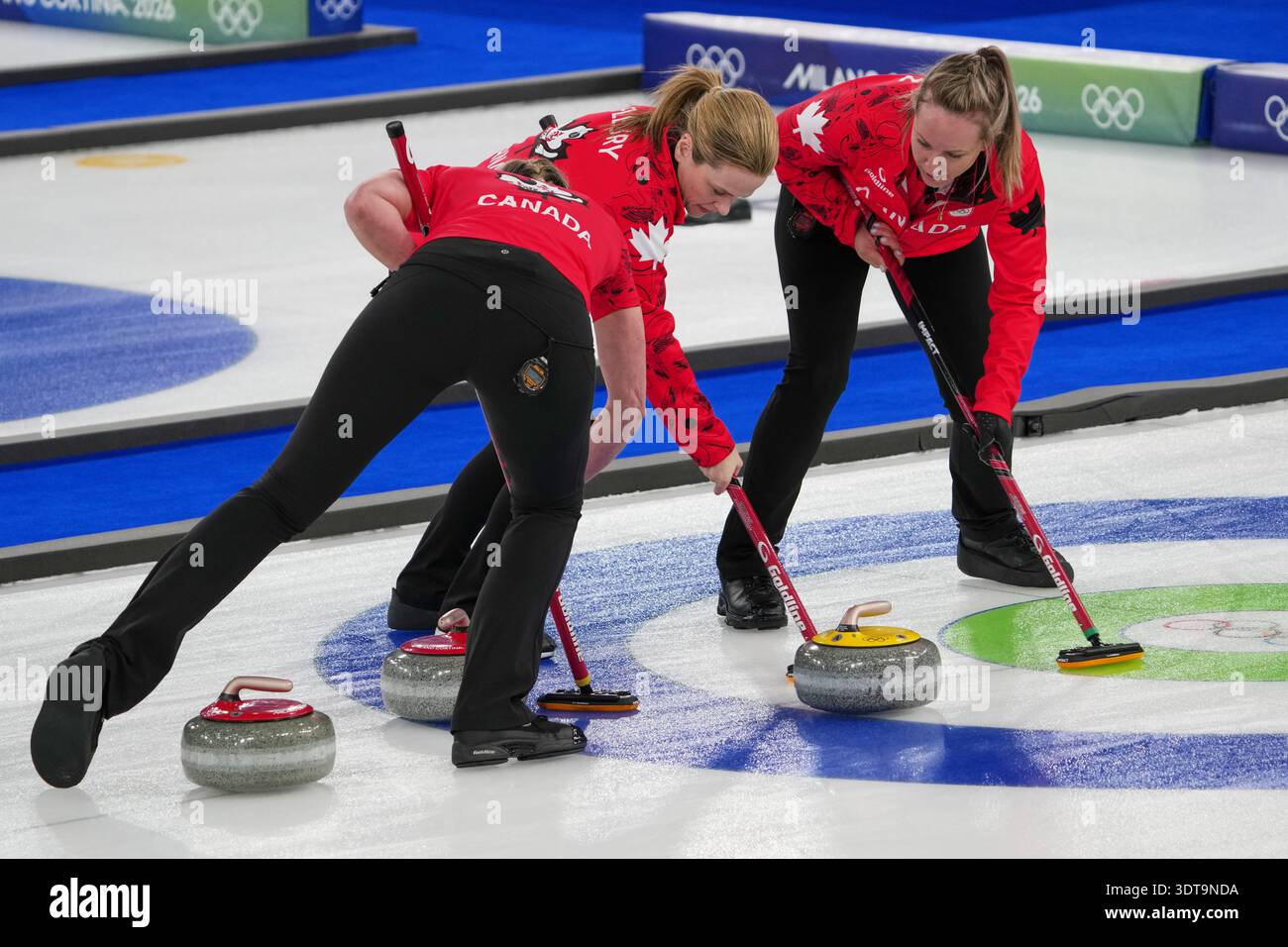 Canada's Rachel Homan, Emma Miskew and Tracy Fleury compete during a ...