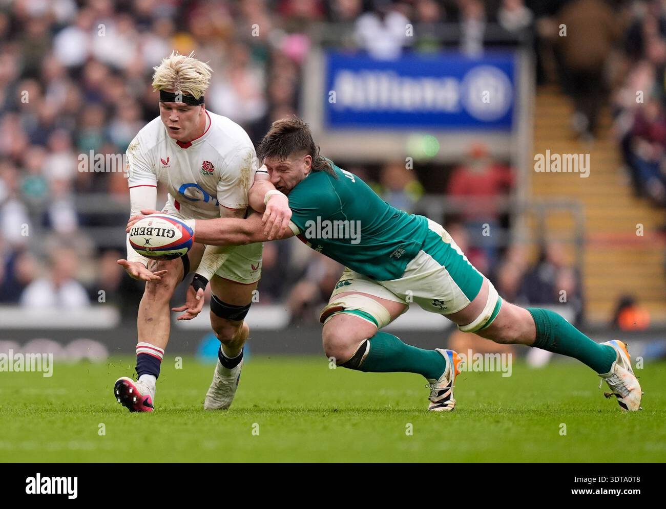 England's Henry Pollock tackled by Ireland's Joe McCarthy during the ...