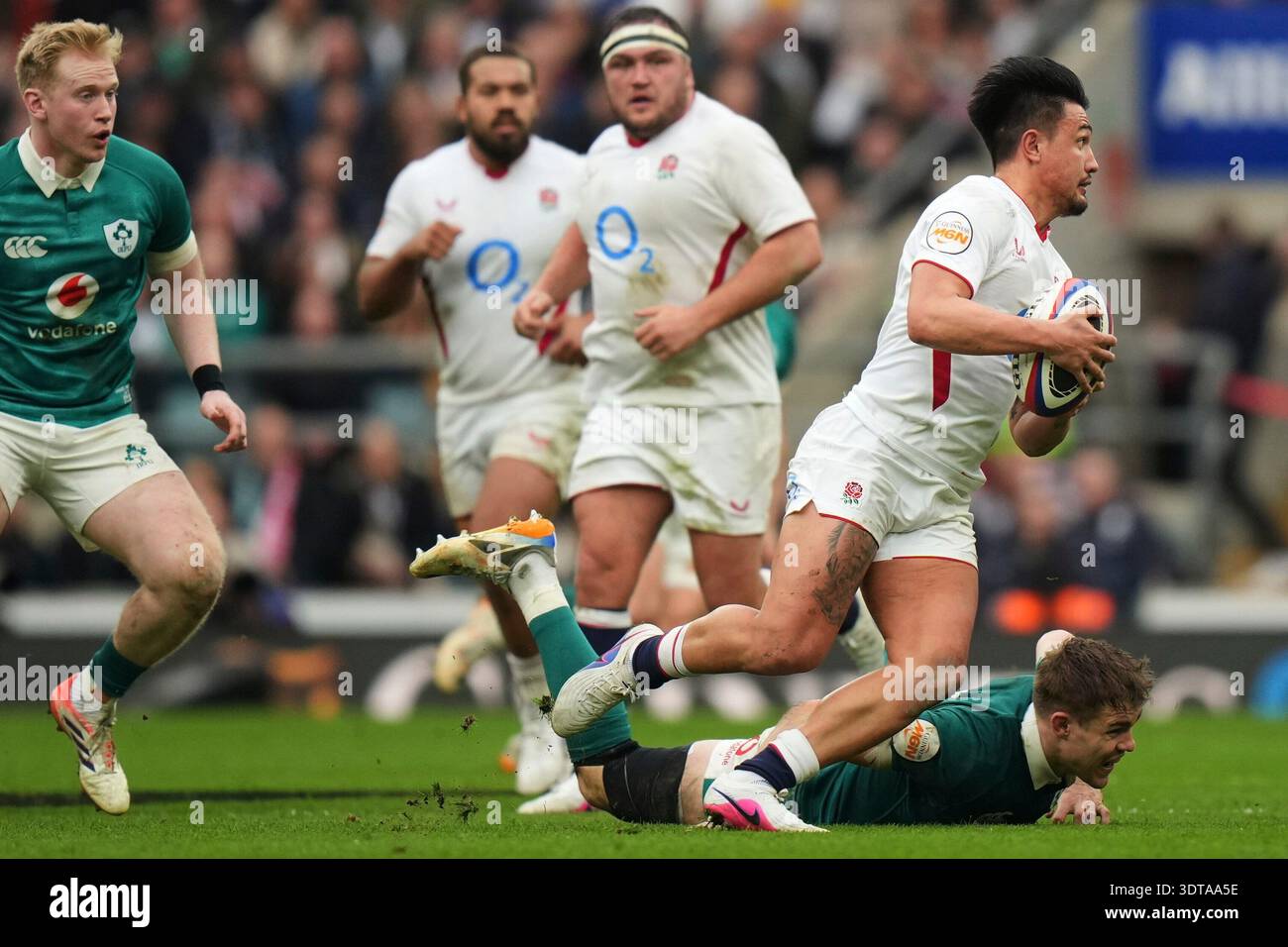 England's Marcus Smith, right, breaks away during the Six Nations rugby ...