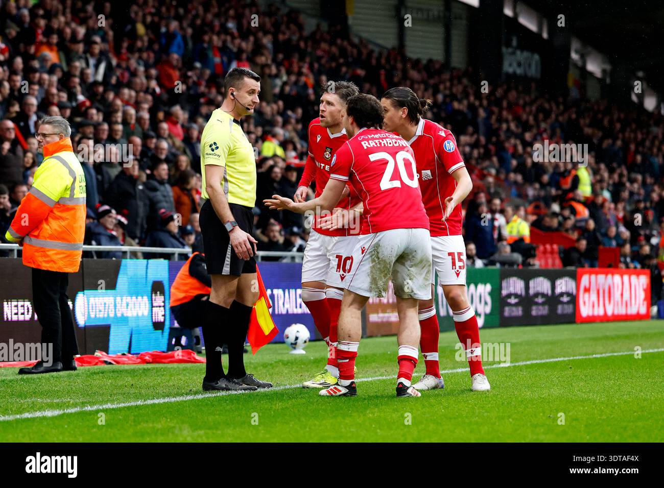 Wrexham's Josh Windass (centre left), Ollie Rathbone and George Dobson ...
