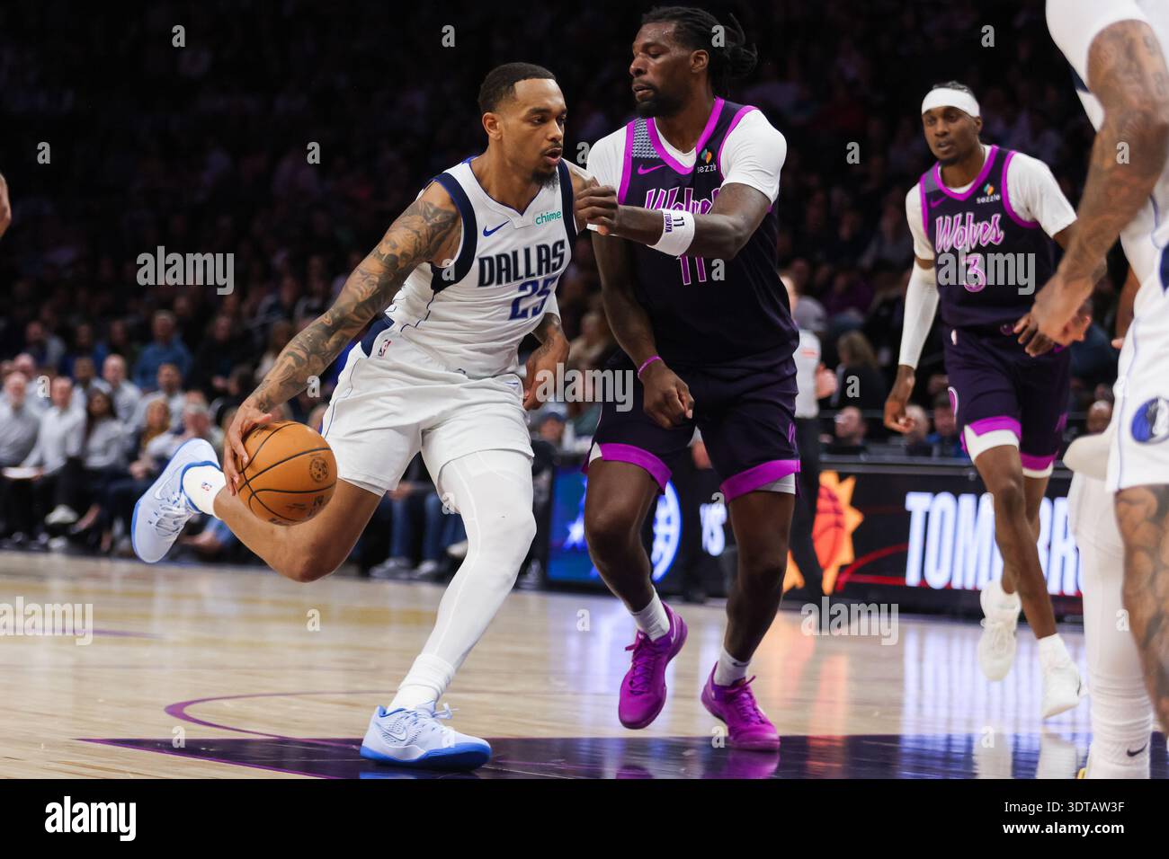 Dallas Mavericks' P. J. Washington Jr. (25) avoids defense by Minnesota ...