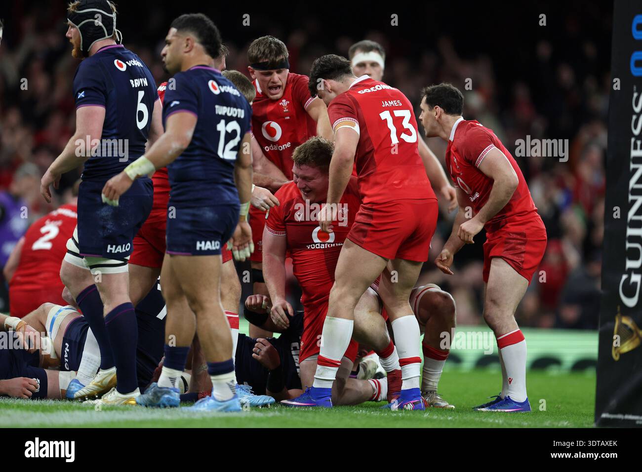 Rhys Carre of Wales (c) celebrates after he scores his teams 1st try ...