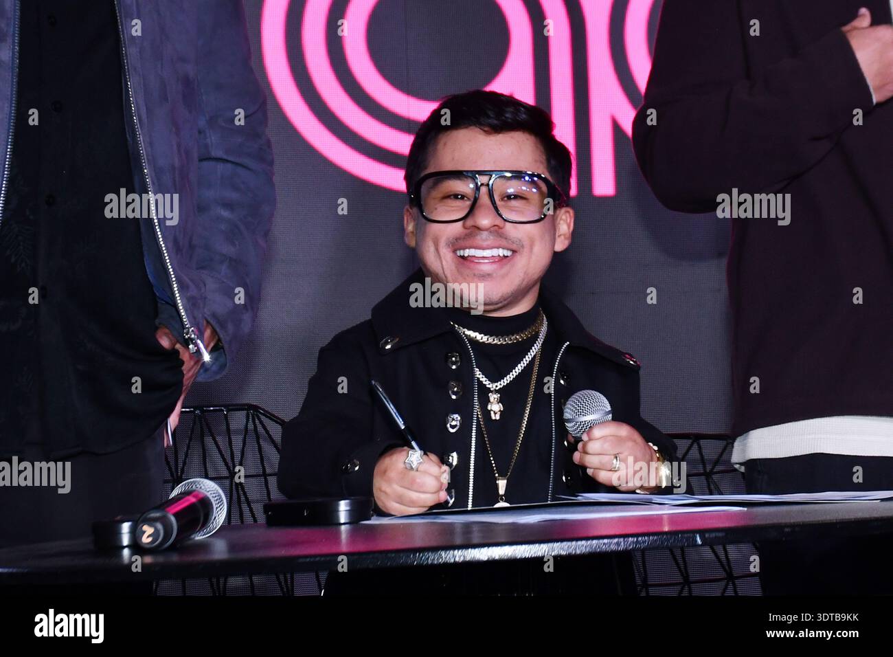 Influencer Abel Saenz, known as Abelito, signs an agreement during a ...