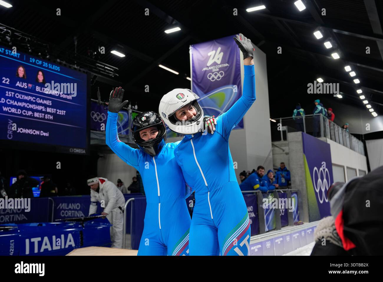 Italy's Giada Andreutti, right, and Alessia Gatti arrive at the finish ...