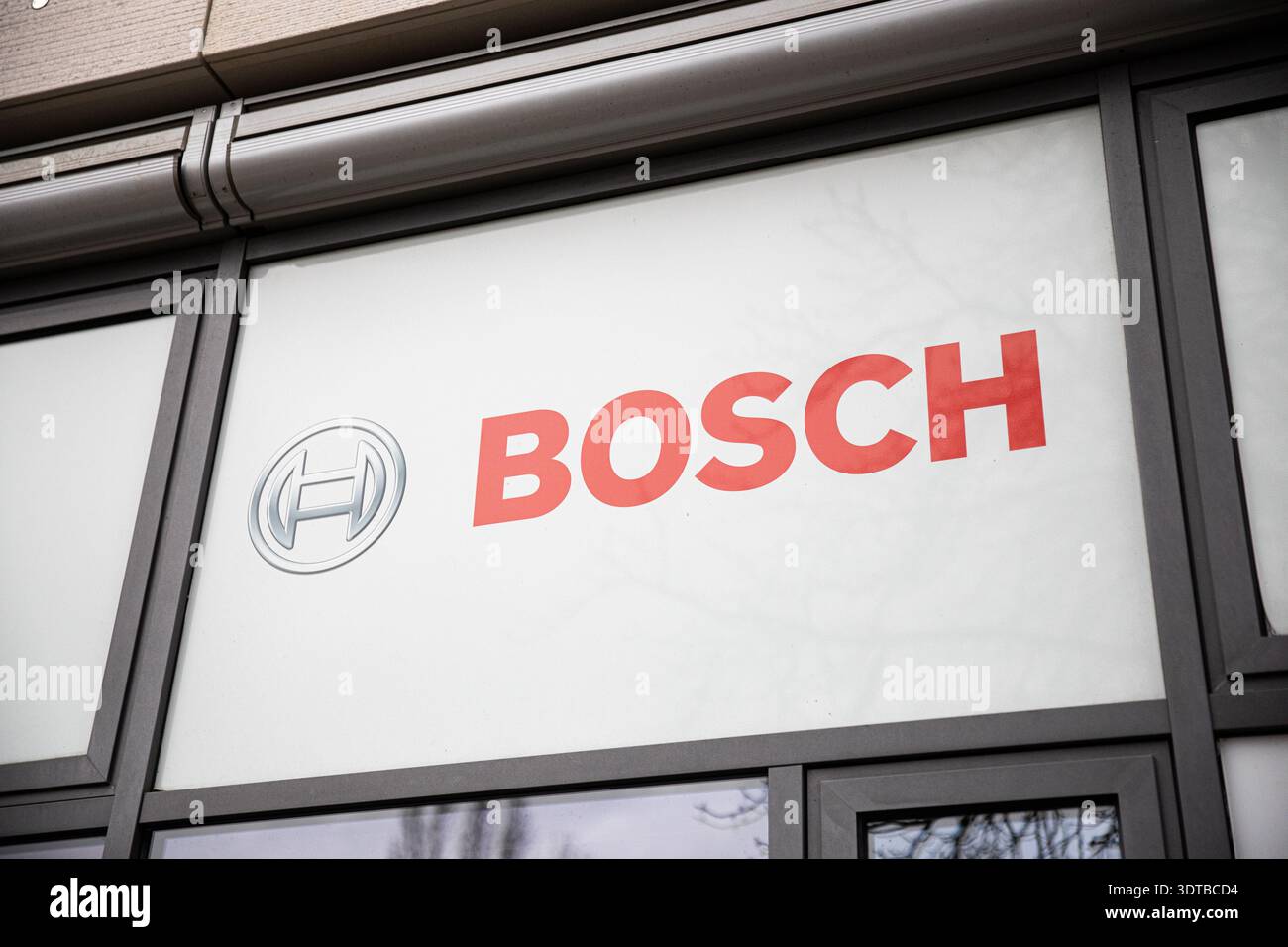 A logo of Bosch is seen on the storefront of an electronics retailer in ...
