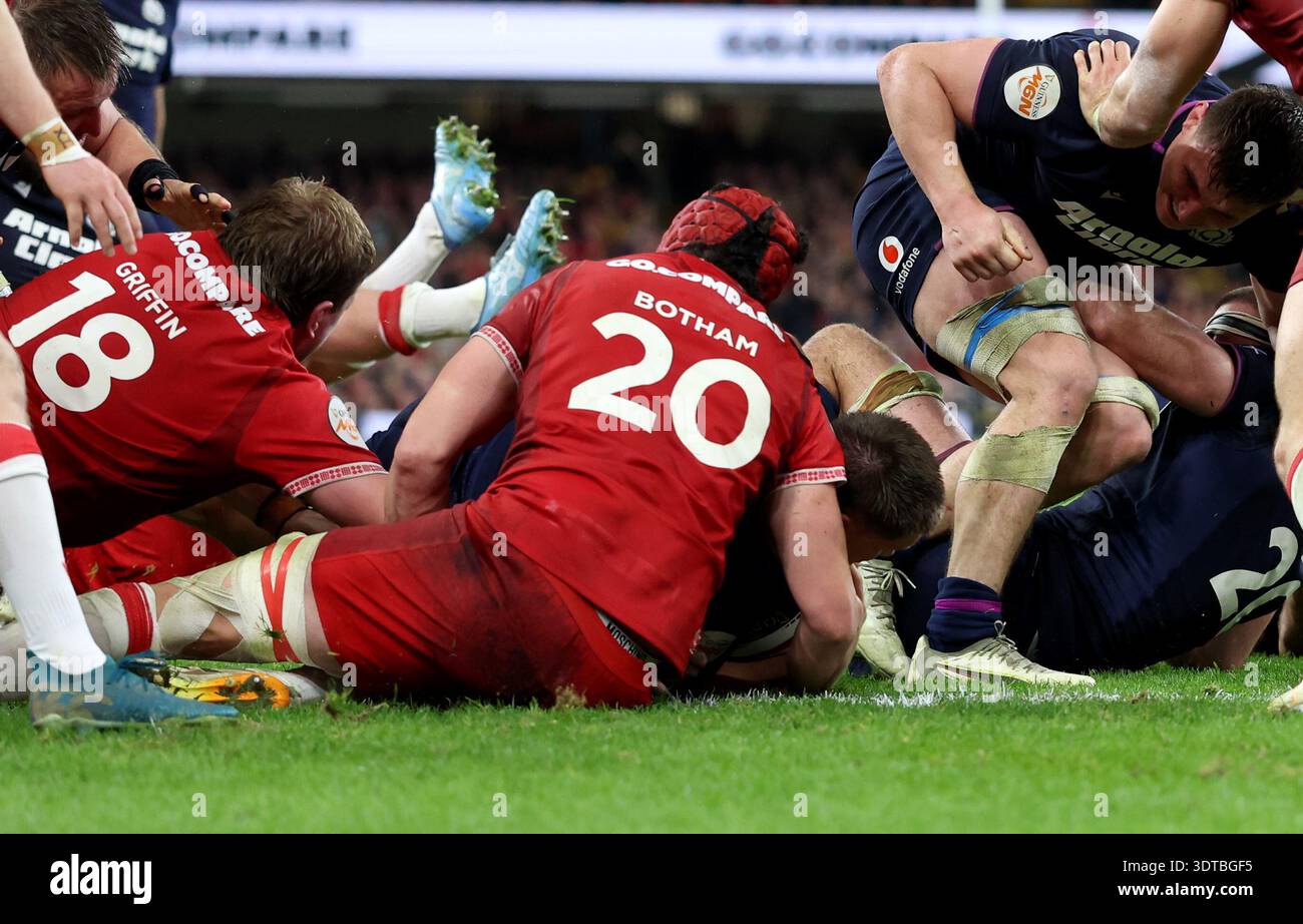Scotland's George Turner (centre rear, obscured) scores his sides ...