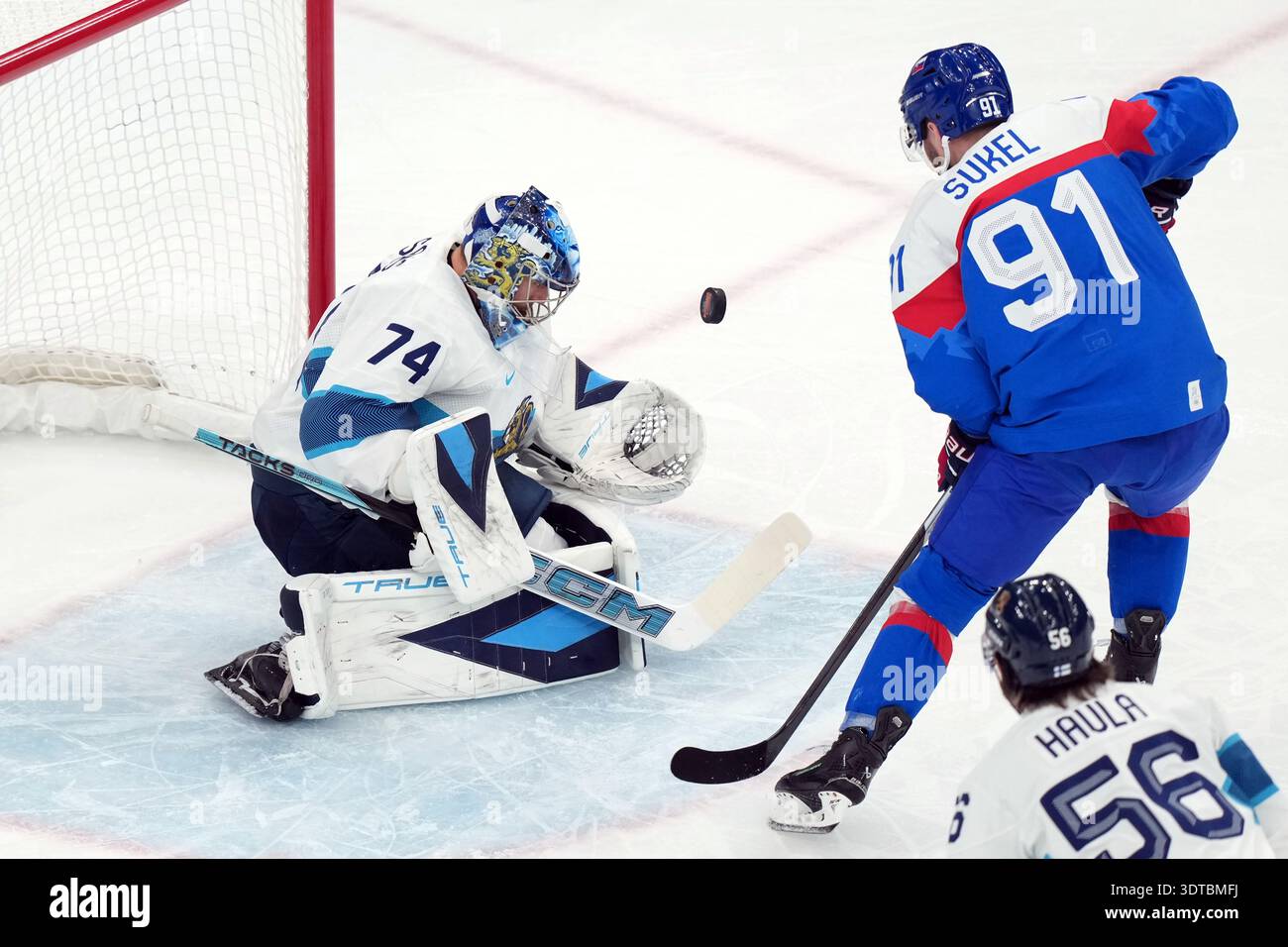 Finland goalkeeper Juuse Saros (74) blocks a shot by Slovakia's Matus ...