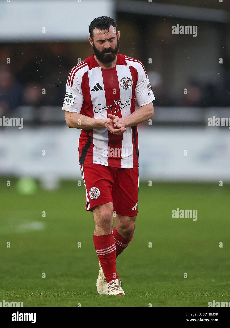 BRACKLEY, ENGLAND - FEBRUARY 21: Jack Price of Brackley Town claps the ...