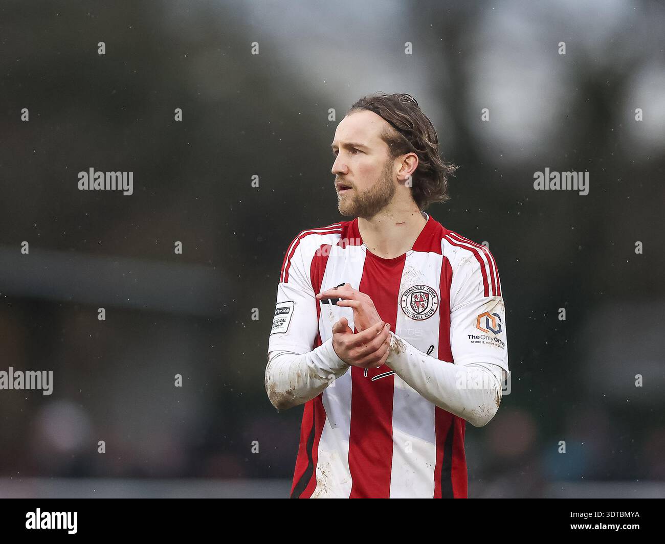 BRACKLEY, ENGLAND - FEBRUARY 21: Morgan Roberts of Brackley Town claps ...