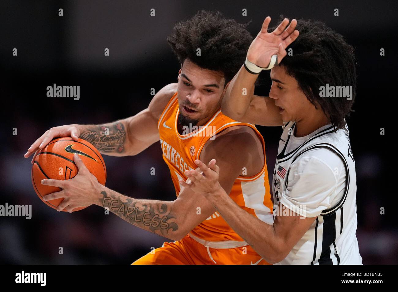 Tennessee guard Bishop Boswell, left, and Vanderbilt guard Tyler Tanner ...